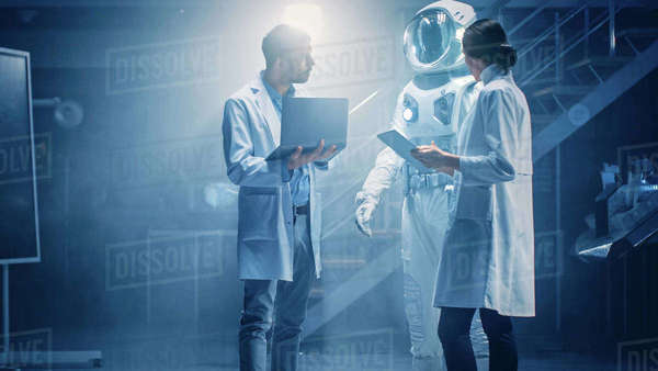 Diverse Team of Aerospace Scientists and Engineers Wearing White Coats ...