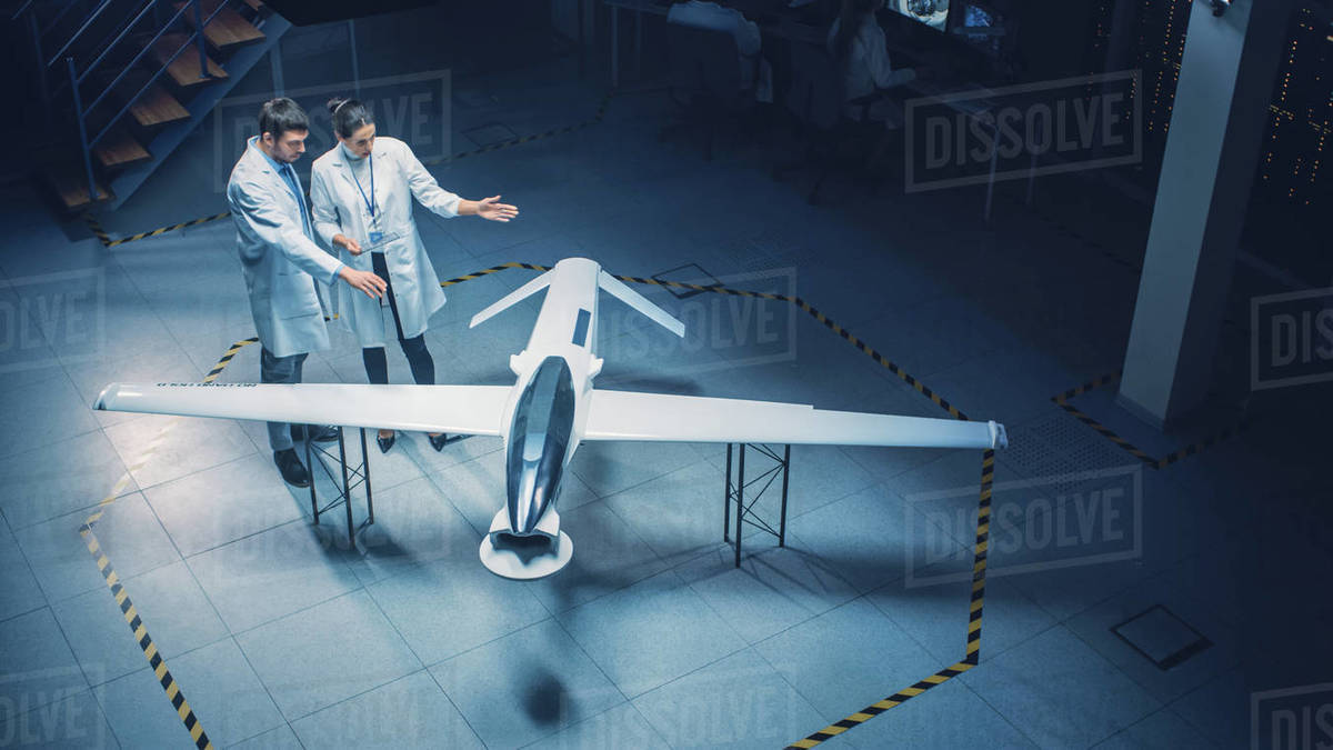 Two Aerospace Engineers Work On Unmanned Aerial Vehicle / Drone ...