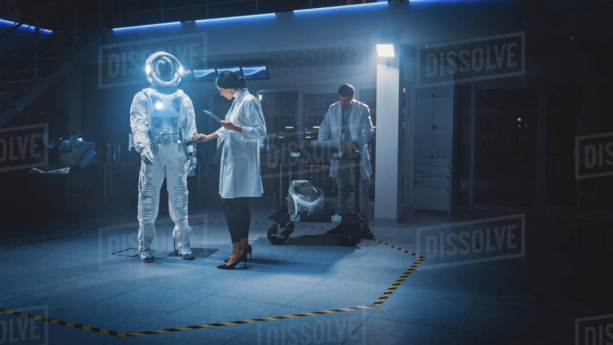 Diverse Team of Aerospace Scientists and Engineers Wearing White Coats ...