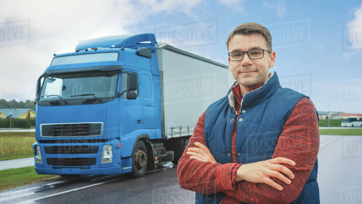 Happy Professional Young Truck Driver Crosses Arms and Smiles on Camera ...