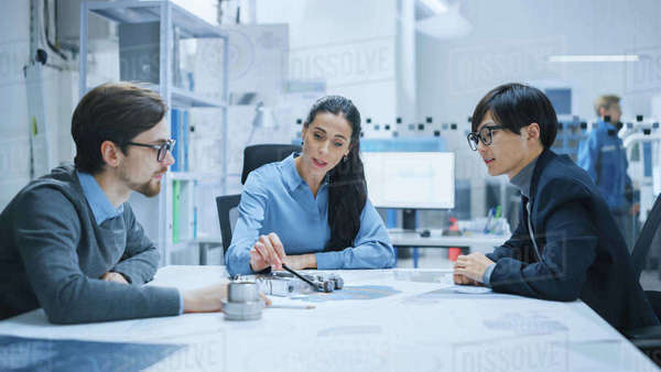 Diverse Team of Computer Engineers and Specialists Gather Around ...