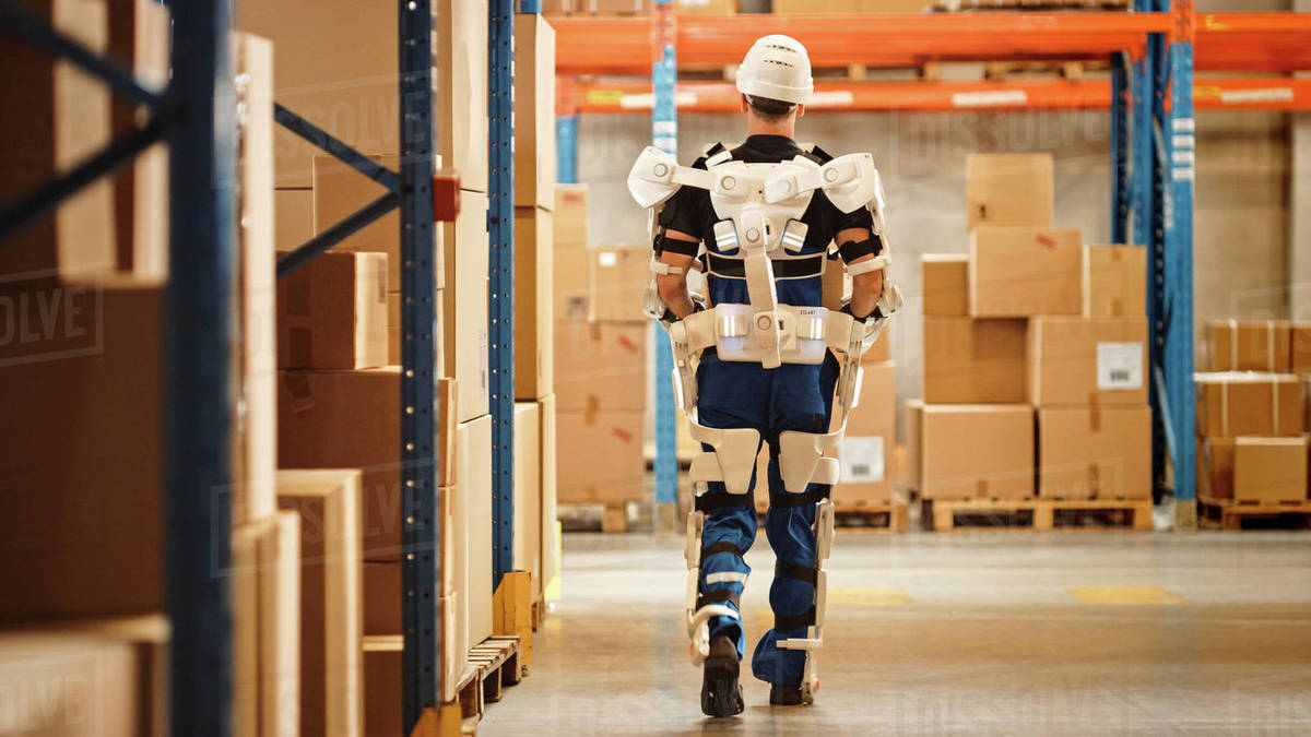 High-Tech Futuristic Warehouse: Worker Wearing Advanced Full Body ...