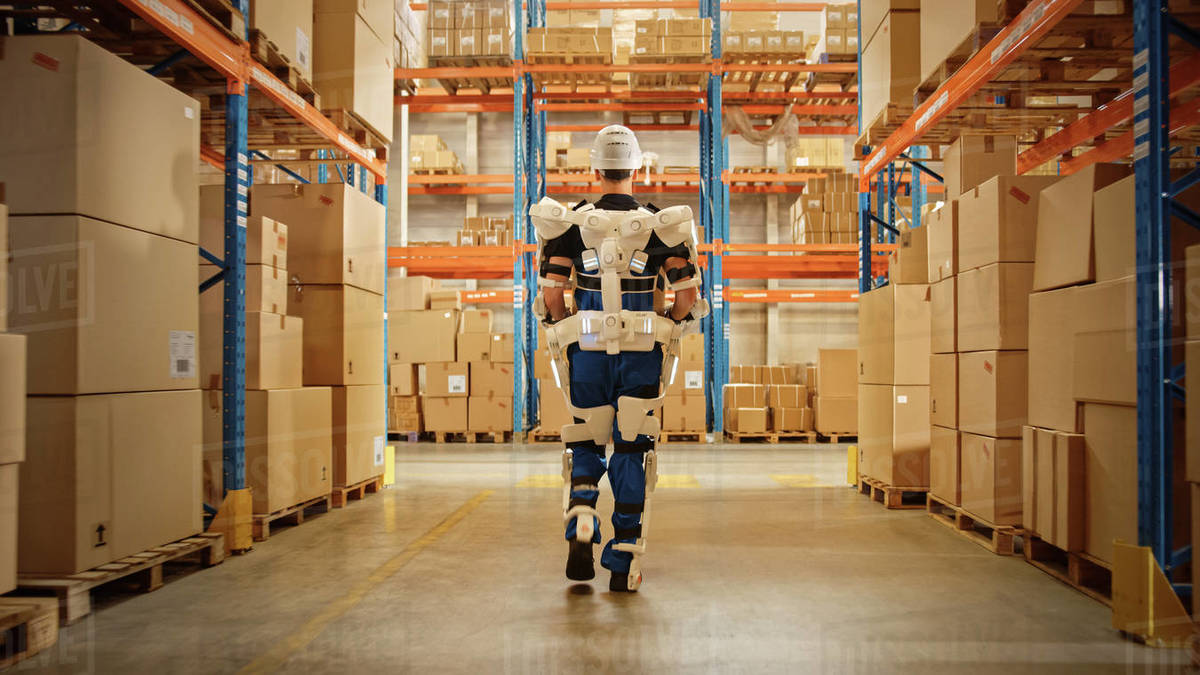 High-Tech Futuristic Warehouse: Worker Wearing Advanced Full Body ...