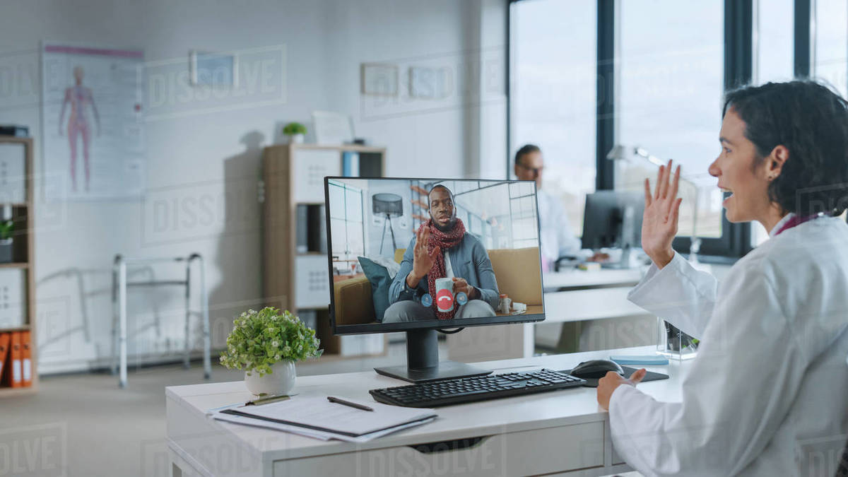 Female Medical Doctor is Making a Video Call with Patient - Royalty ...