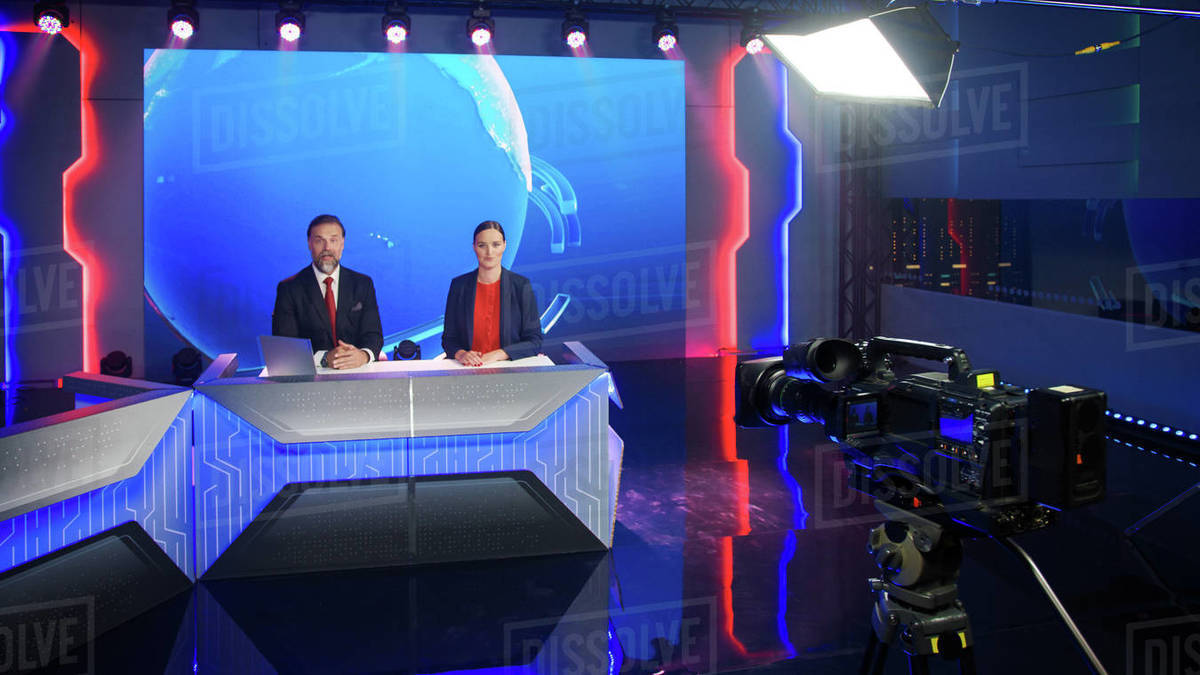 Live News Studio with Professional Anchors doing Report - Royalty-free ...