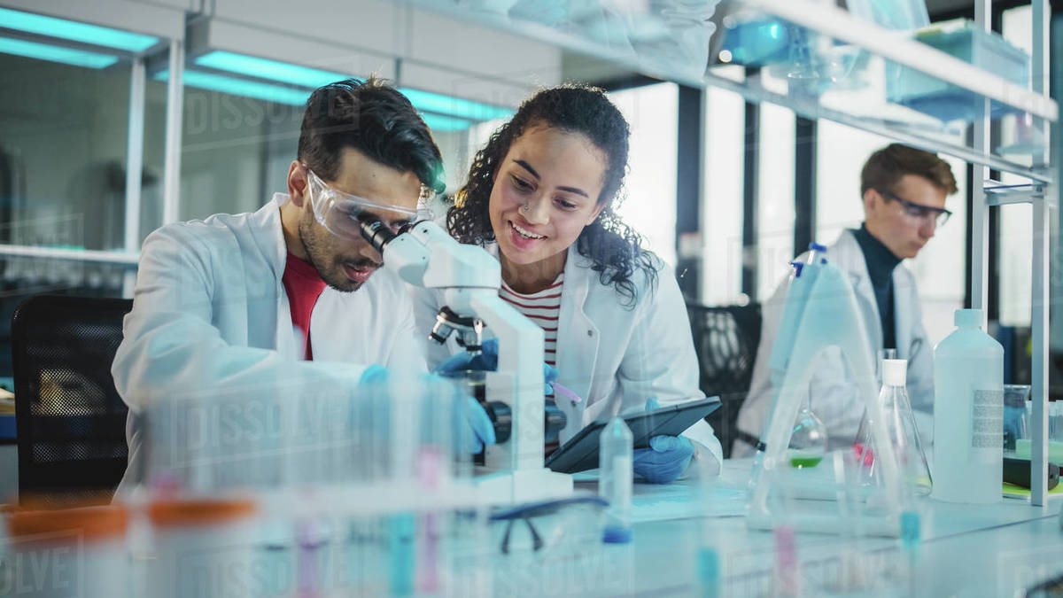 Modern Medical Research Laboratory: Portrait of Latin and Black Young ...