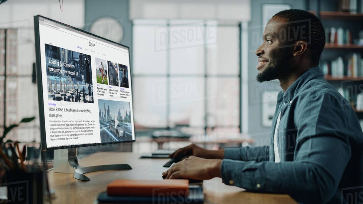 Specialist Working on Desktop Computer in Creative Home Living Room ...