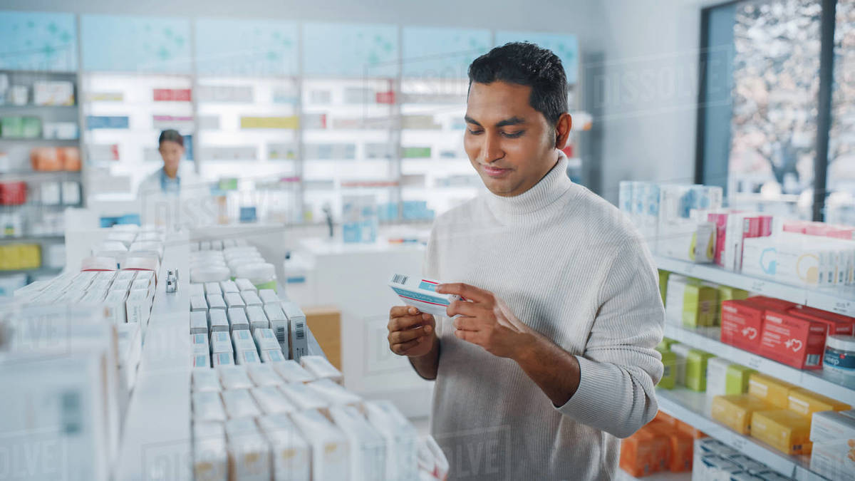 Man Choosing to Buy Medicine Browsing through the Shelf - Royalty-free ...