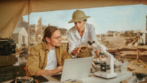 Two Archeologists Talk about Ancient Civilization - Stock Photo - Dissolve