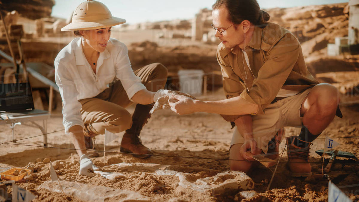 Two Paleontologists Use Tablet Computer to Analyze Skeleton of Newly ...