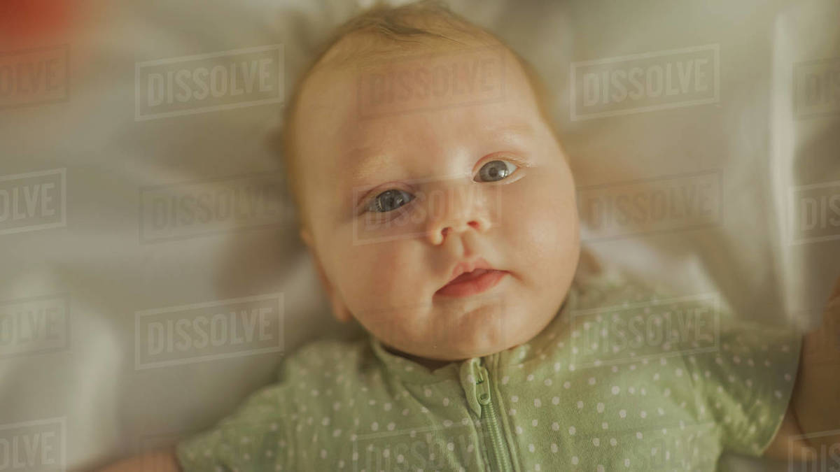 Close Up Shot of a Newborn Baby Lying on the Back in Child Crib ...