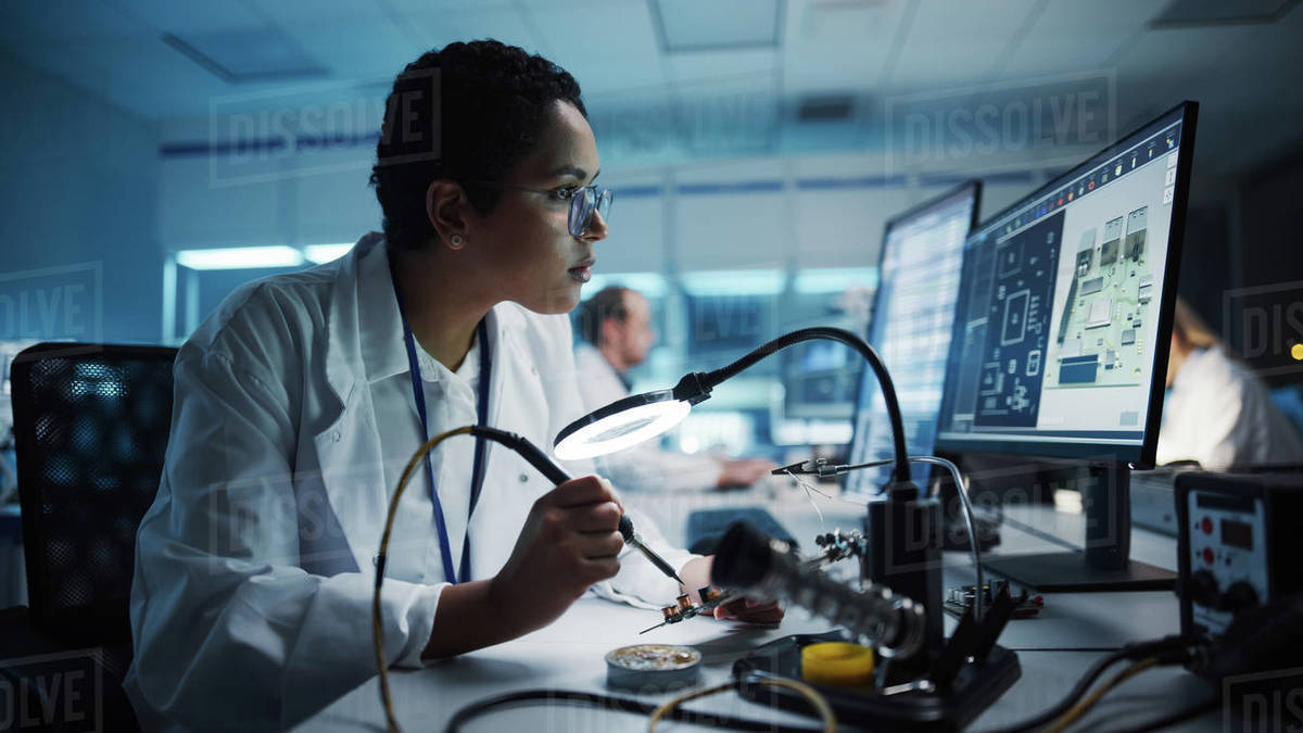 Black Female Engineer Does Computer Motherboard Soldering - Royalty ...