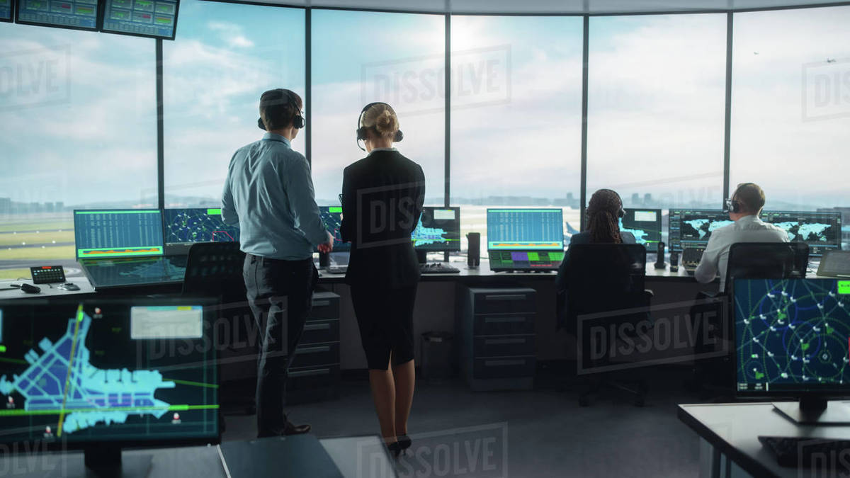 Diverse Air Traffic Control Team Working in a Modern Airport Tower ...
