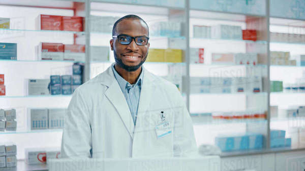 Portrait of Professional Black Male Pharmacist Working on Computer ...