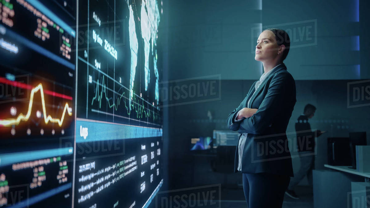 Young Female Computer Science Engineer Looking at Big Screen Display ...