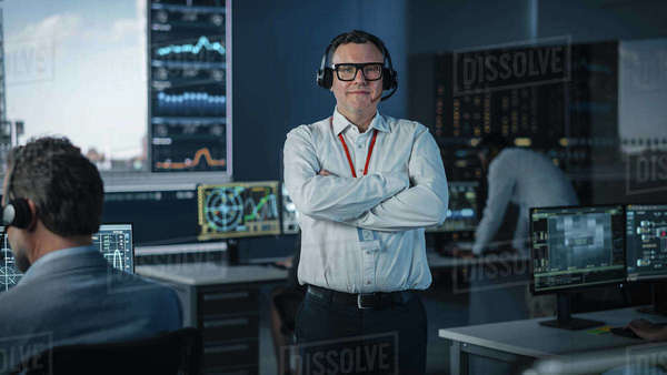 Portrait of a Happy Male Flight Controller Posing for Camera in a ...