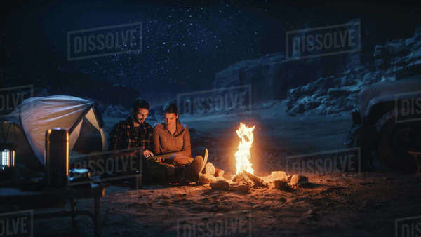 Happy Couple Nature Camping in the Canyon at Night, Use Digital Tablet ...
