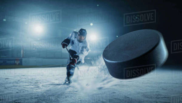 Ice Hockey Rink Arena: Professional Player Shooting the Puck with ...