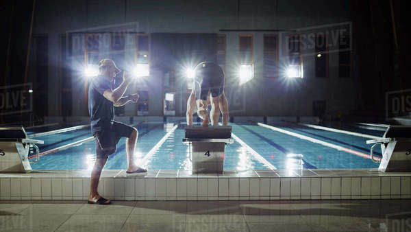 Swimming Pool: Professional Trainer Training Future Champion Swimmer ...