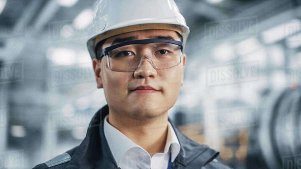 Portrait of a Professional Asian Heavy Industry Engineer Smiling on ...