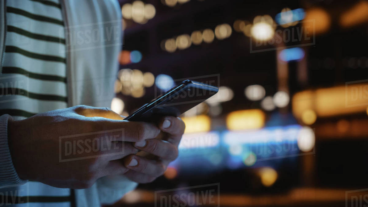 Focus on Man Hands Using Smartphone Walking Through Night City Street ...