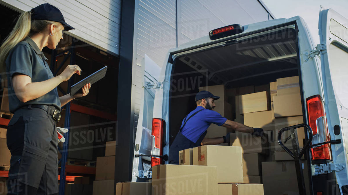 Diverse Team of Workers use Hand Truck Loading Delivery Van with ...