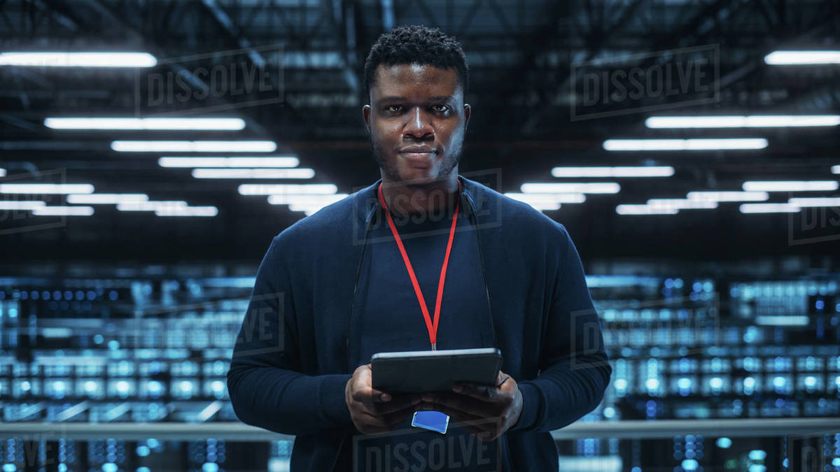 Portrait of a Data Center Engineer Using Laptop Computer - Royalty-free ...