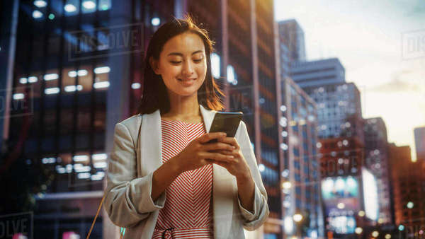 Portrait of a Japanese Female Wearing Smart Casual Clothes and Using ...