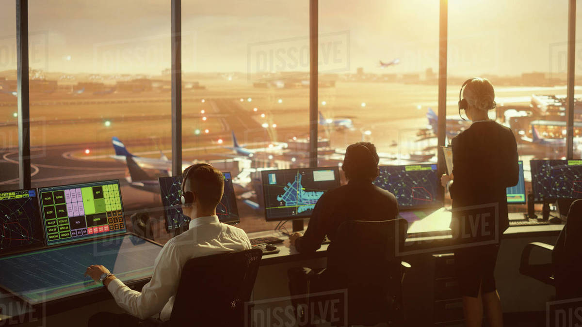 Diverse Air Traffic Control Team Working in a Modern Airport Tower at ...