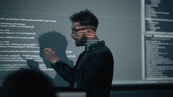 Teacher Giving Computer Science Lecture to Diverse Group of Female and ...