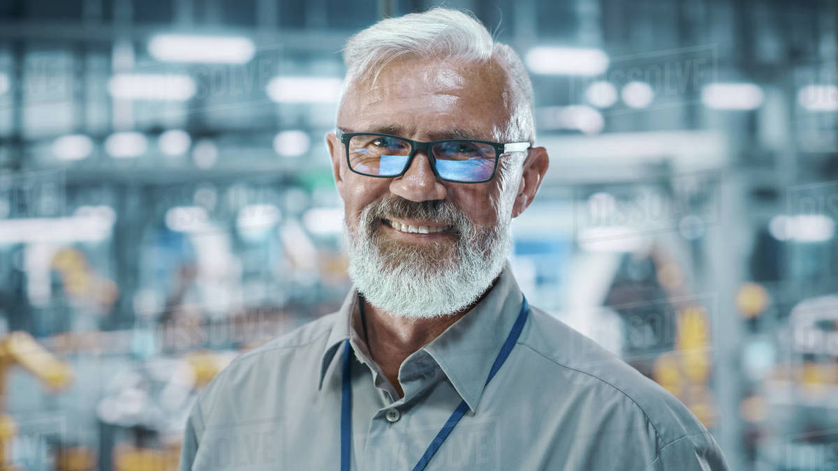Portrait of Senior White Male Chief Engineer Looking at Camera and ...