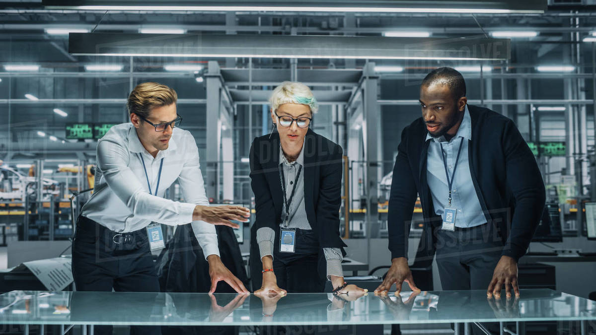 Diverse Team of Automotive Engineers Working in Office at Car Factory ...
