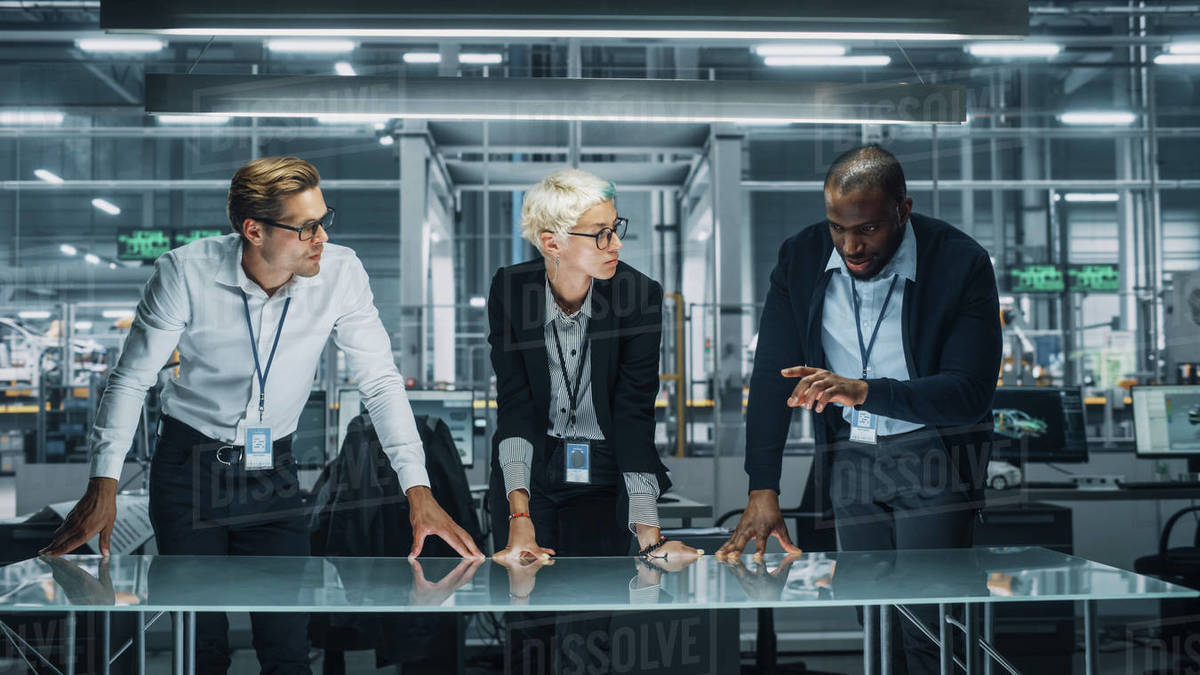 Diverse Team of Automotive Engineers Working in Office at Car Factory ...