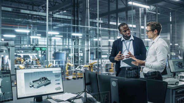 Two Diverse Automotive Industrial Engineers Talking About Vehicle ...