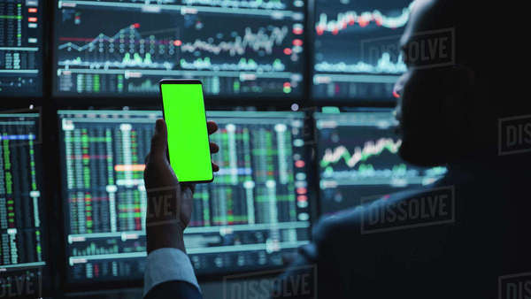 Financial Analyst Using Smartphone with Green Screen Chroma Key Mock Up ...