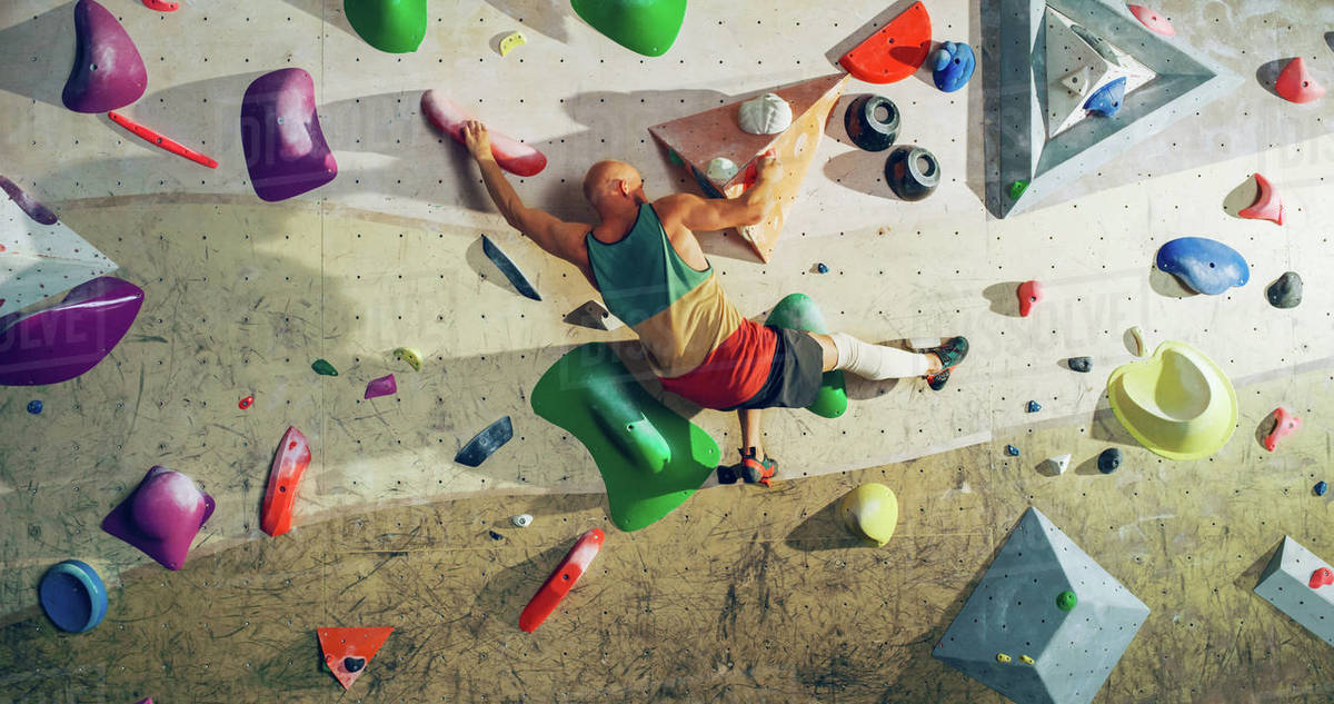 Strong Experienced Rock Climber Practicing Solo Climbing on Bouldering ...