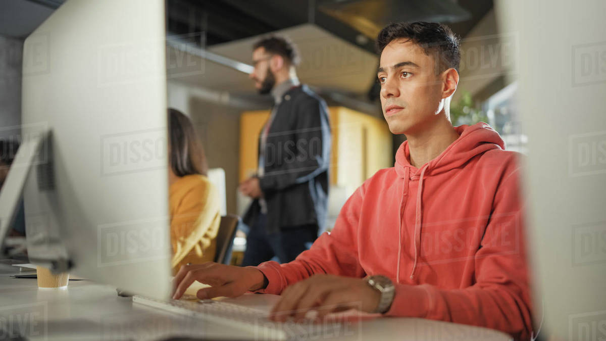 Male Student Studying in University with Diverse Multiethnic Classmates ...