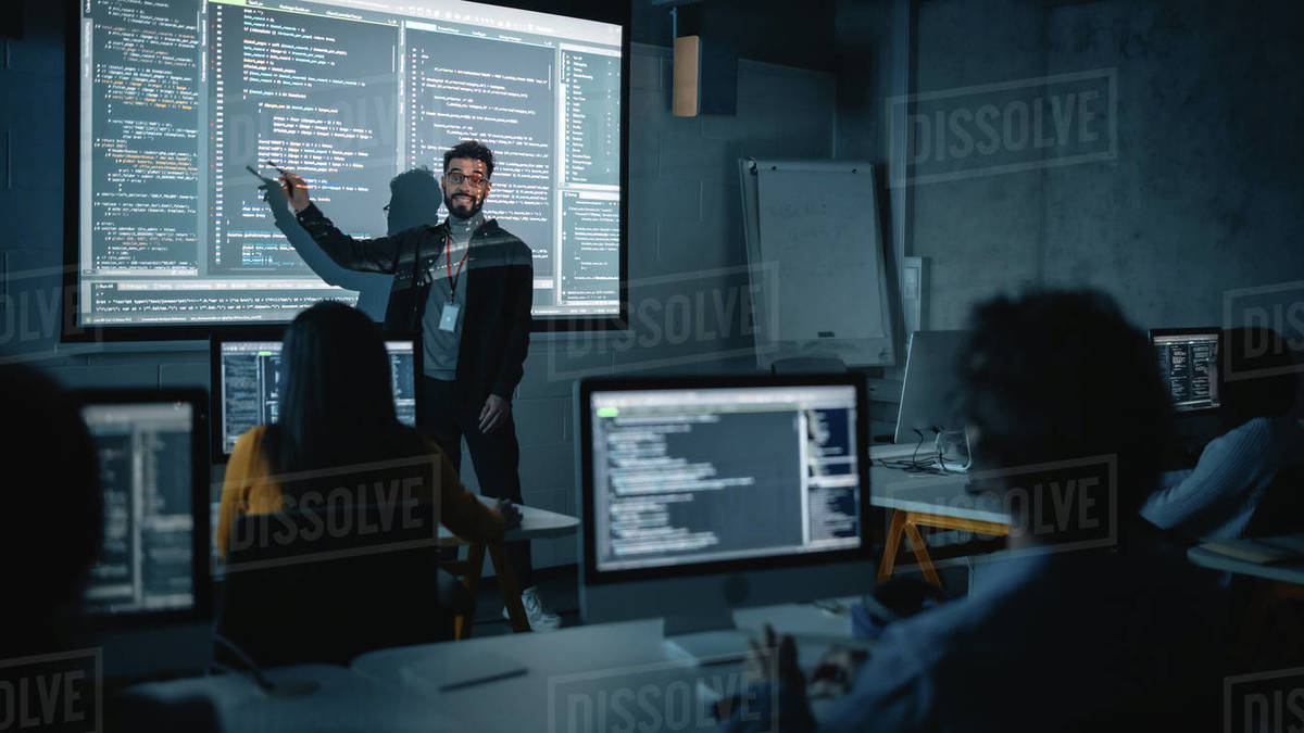 Teacher Giving Computer Science Lecture to Diverse Multiethnic Group of ...