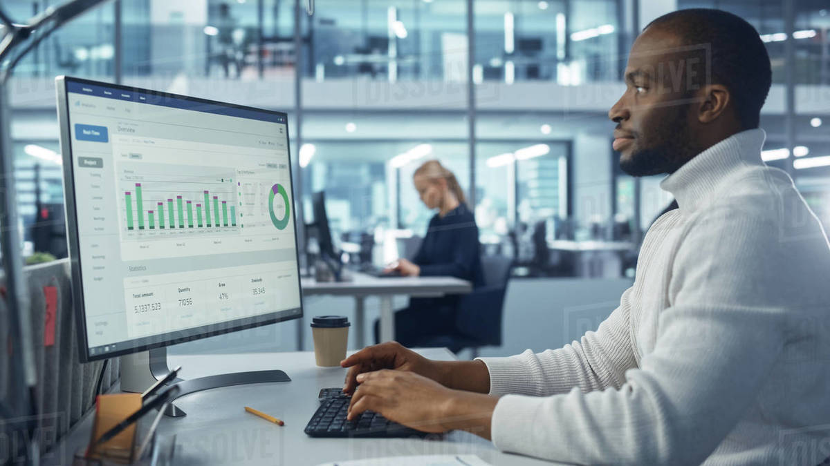 IT Specialist Using Desktop Computer with Big Data Statistics - Royalty ...