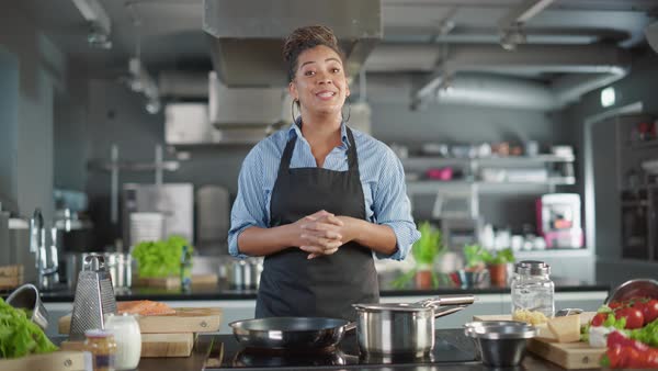 TV Cooking Show in Restaurant Kitchen: Portrait of Black Female ...