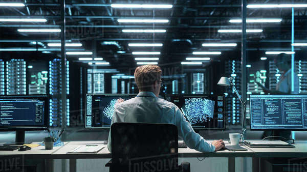 Software Developer Works with AI Analysis on his Computer with Two ...