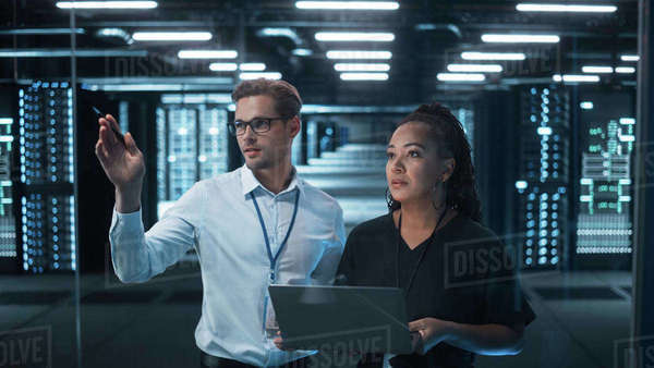 Entrepreneur and IT Specialist Talk and Look at the Laptop in Diverse ...