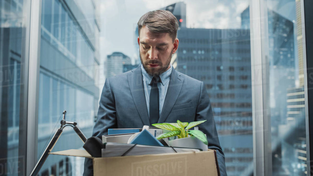 Fired Manager Going Down from Office in a Glass Elevator in Modern ...