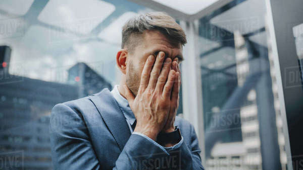 Stressed Out Manager Going Down from Office in a Glass Elevator in ...