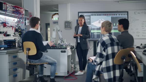 Black Teacher and Diverse Group of Young Students Brainstorming at ...