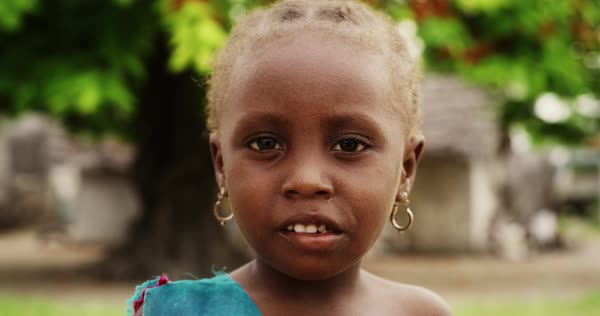 Close Up Portrait of Cute Authentic African Little Girl Looking at the ...