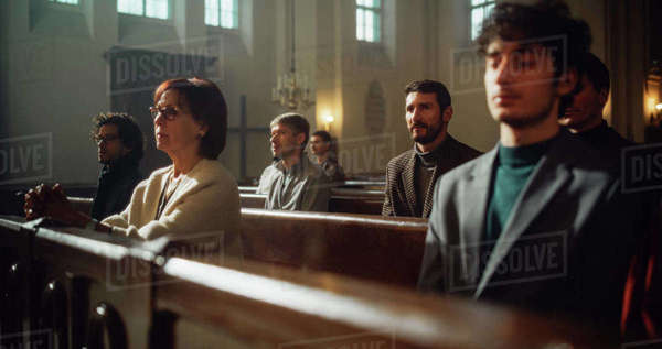 Group Of Faithful Parishioners In Grand Old Church Listening to Sermon ...