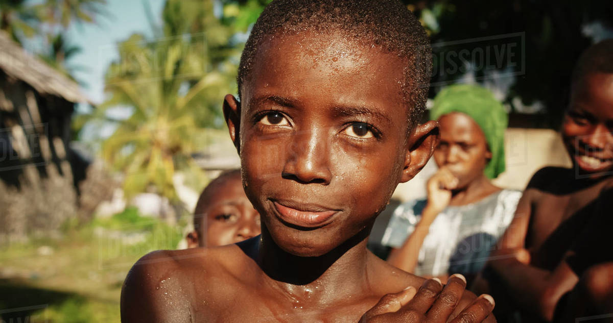 Close Up Portrait of a Playful Authentic African Kid Looking at the ...