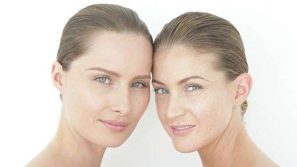 Two women forehead to forehead then looking at camera. - Stock Video ...