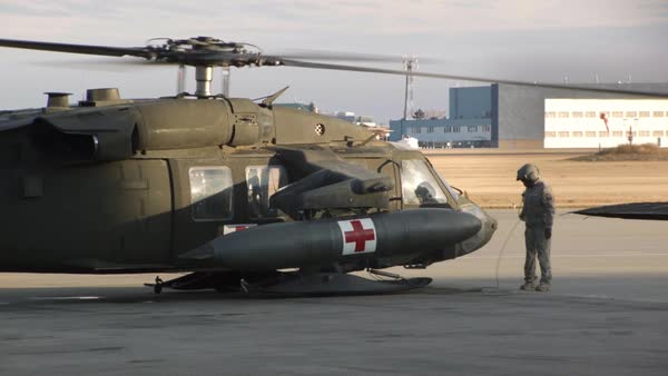 Hand-held shot of a person examining a Red Cross helicopter - HD ...